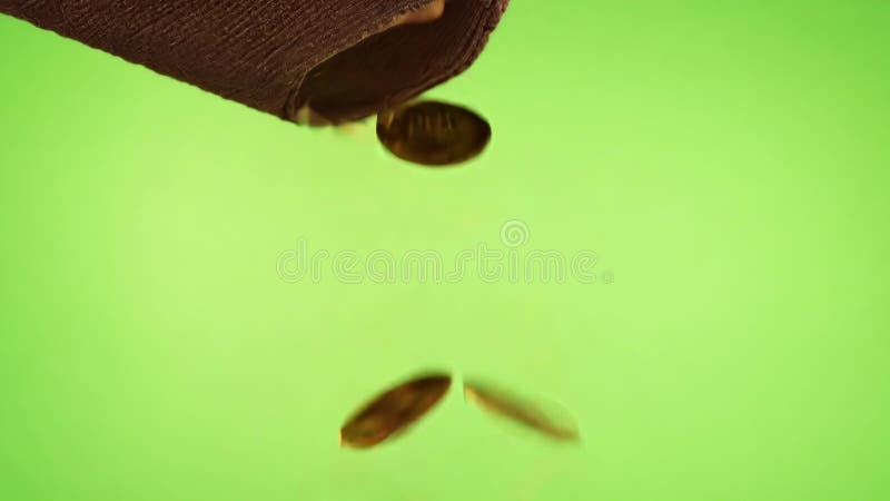 A Sparkling Dance of Coins Falling from a Velvet Pouch Tering in a ...