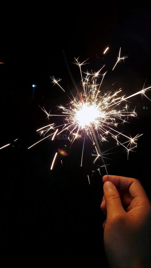 Sparkling Fireworks at Night with Yellow Sparkles of Light Stock Photo ...