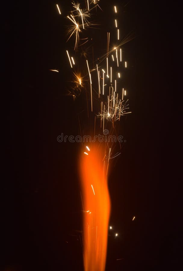 Sparkling Flames with the Fireworks Photograph Stock Photo - Image of ...