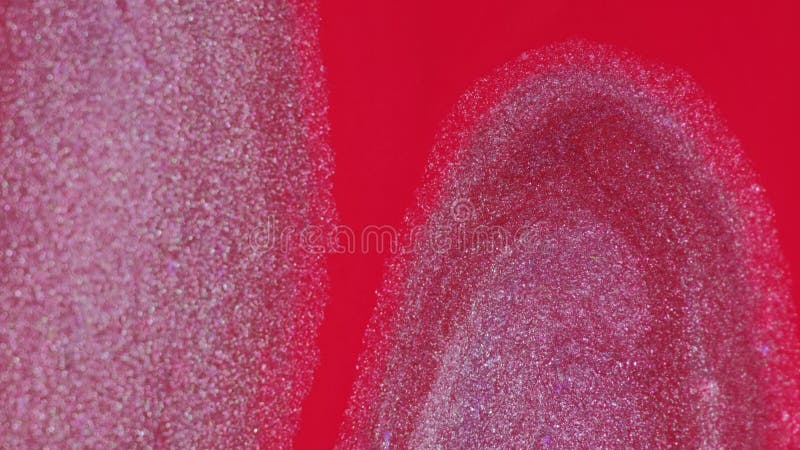 Sparkling Ink Glitter Fluid Texture Pink Red Spill Stock Footage