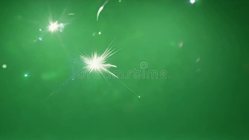 Sparkling Lights Ling Against a Green Background. Green Screen ...