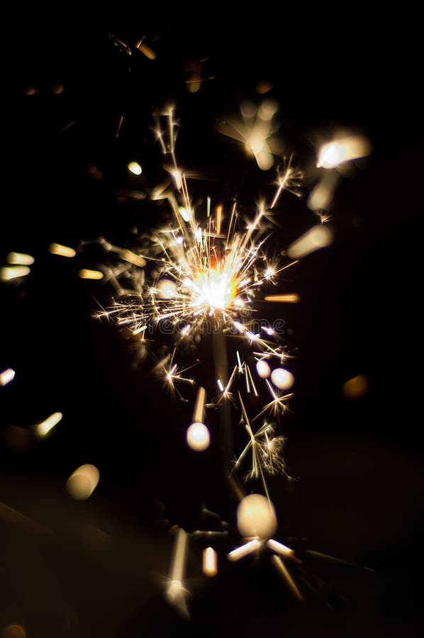 A Sparkling Sparkler at a Party or New Year`s Eve Stock Photo - Image ...
