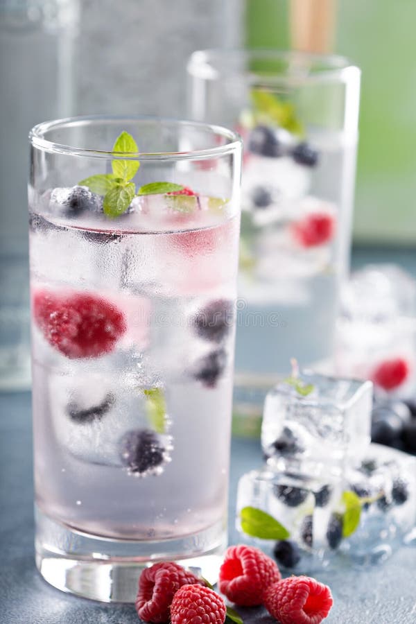 Sparkling Water with Berry and Herb Ice Stock Photo - Image of blue ...