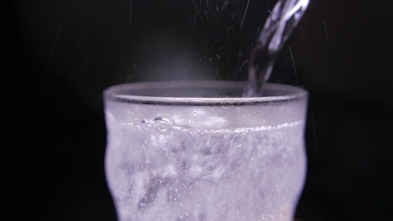 Sparkling Water Glass Melting Ice Cubes. 4K UHD Stock Video - Video of ...