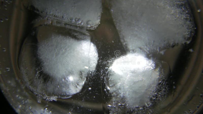 Sparkling Water Glass Melting Ice Cubes. 4K UHD Stock Video - Video of ...