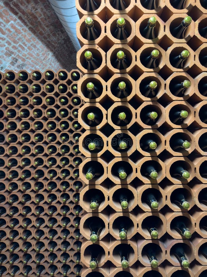 In a Sparkling Wine Cellar Many Bottles of Sparkling Wine are Stored ...