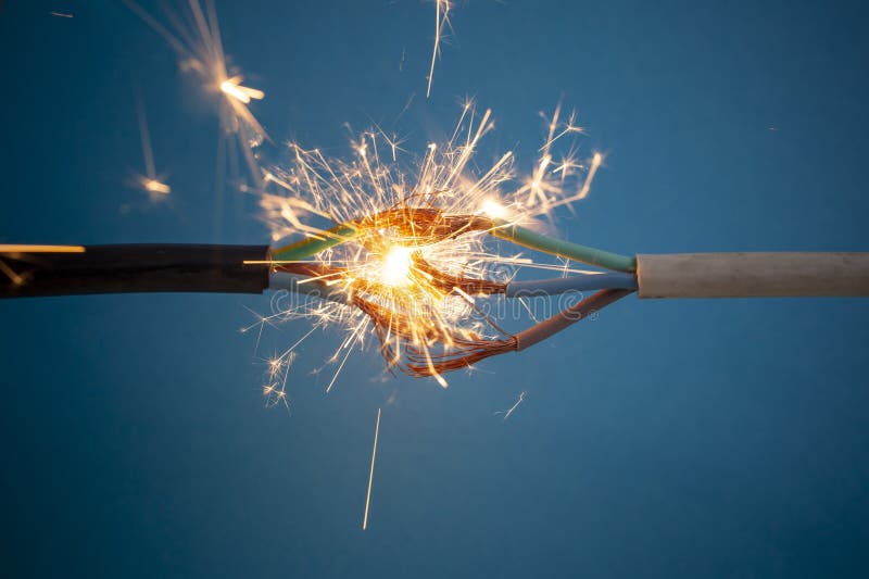Sparks Explosion between Electrical Cables, on Deep Blue Background ...