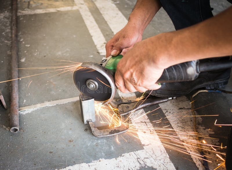 Sparks while grinding iron stock image. Image of factory - 69970429