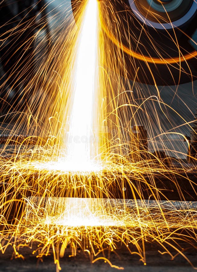 Sparks while grinding iron stock photo. Image of material - 99592086