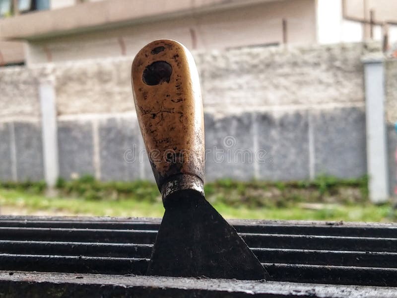 A Spatula with a Yellow Handle Sits on Top of the Burner. Stock Image ...