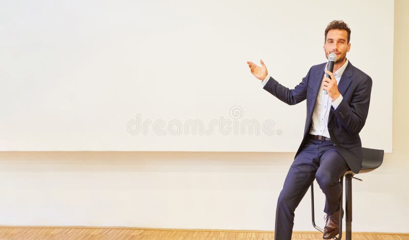 Speaker at Conference Gives Lecture with Microphone Stock Image - Image ...