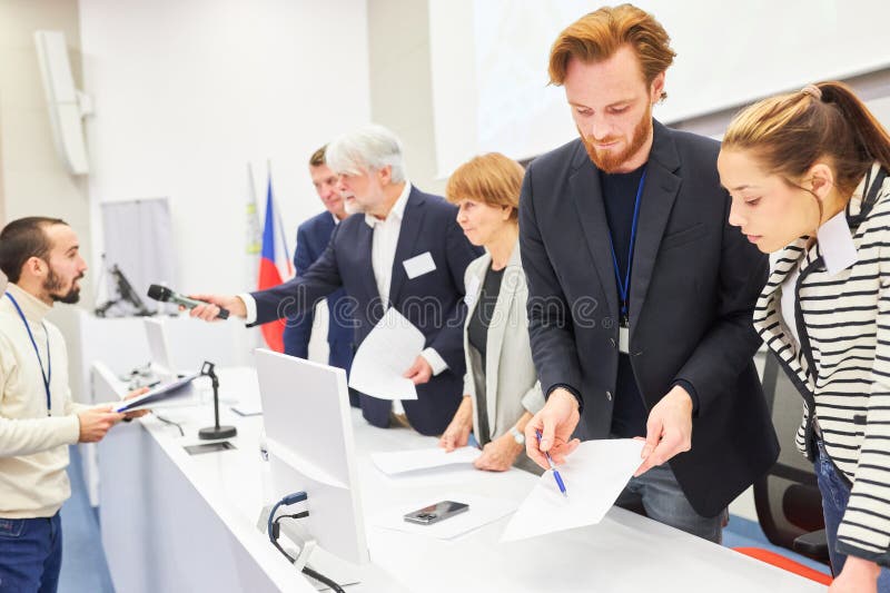 Speaker Discussing with Colleague during Business Conference Event ...