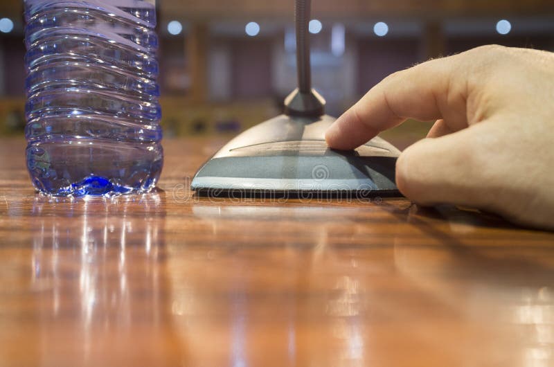 Speaker Hand Pressing on-off Button of a Table Conference Microphone ...