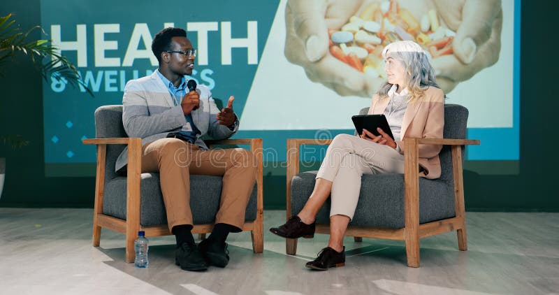 Speaker, Health Conference and Speech of Man on Stage with Host on Mic ...
