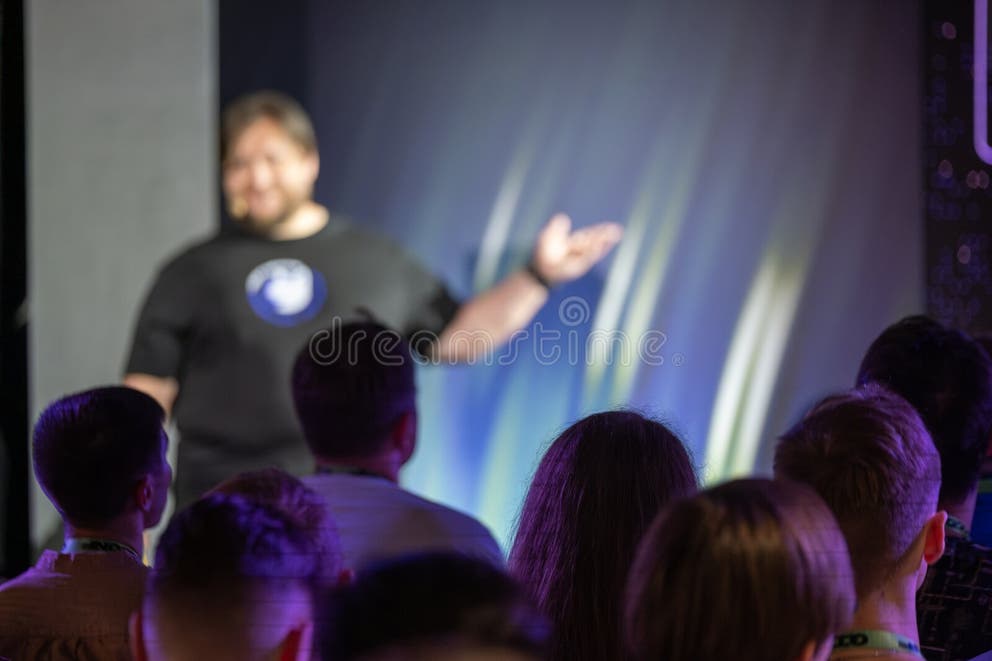 Speaker Presenting at a Conference in Front of Audience Stock Photo ...