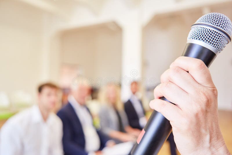 The Speaker`s Hand Holds a Microphone during a Lecture Stock Image ...