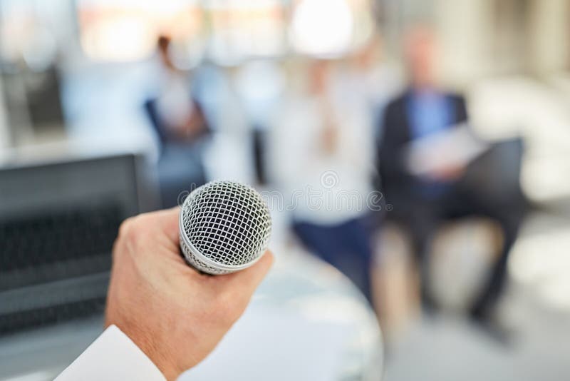 Speaker or Speaker with the Hand on the Microphone Stock Photo - Image ...