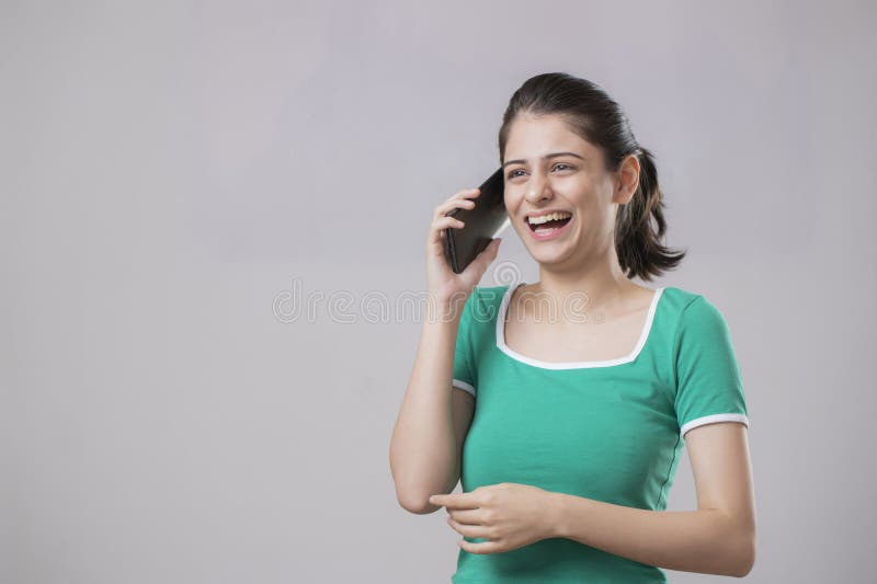 Innocent Model Laughing while Talking on Phone Stock Image - Image of ...