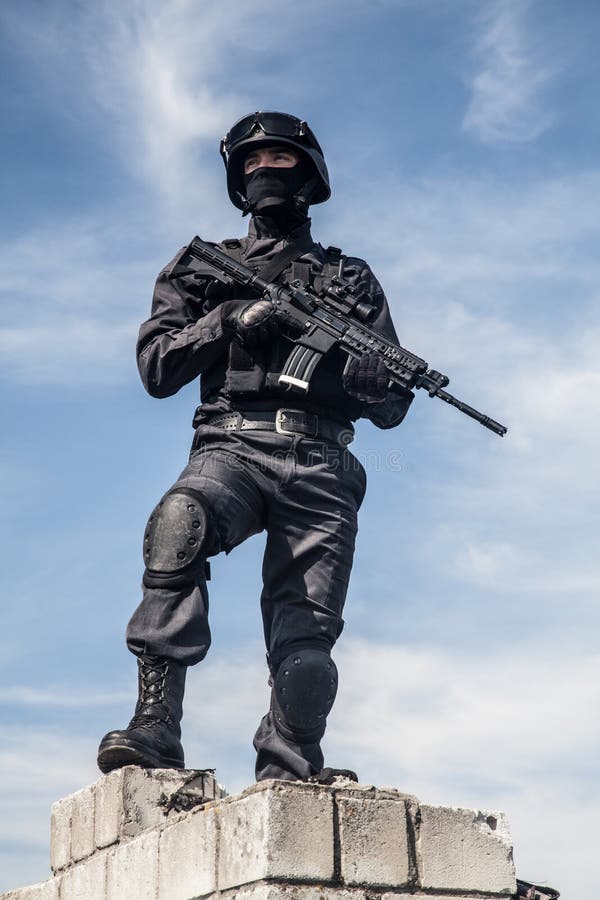 Spec ops police SWAT stock image. Image of helmet, pistol - 60977471