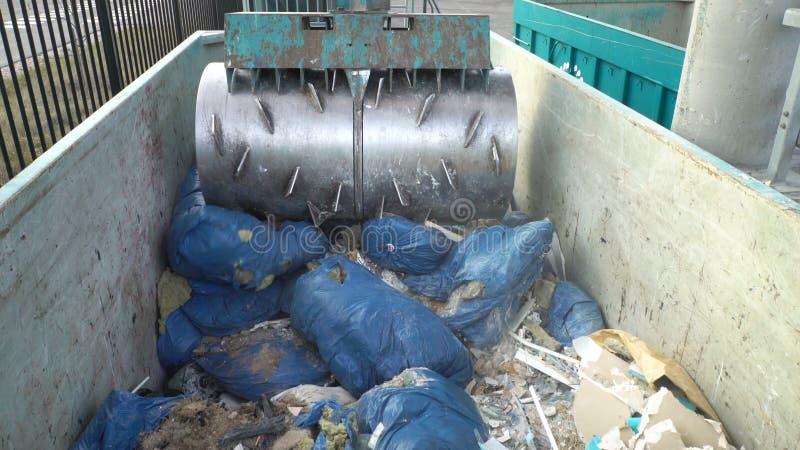 Special Equipment is Pressing Construction Waste in a Container for ...