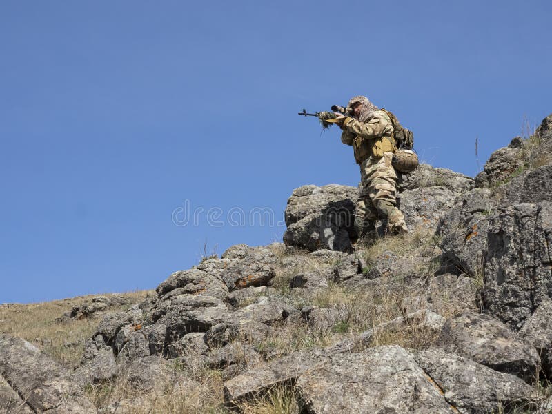 Special Forces Professional Sniper Aiming at the Enemy in the Mountains ...
