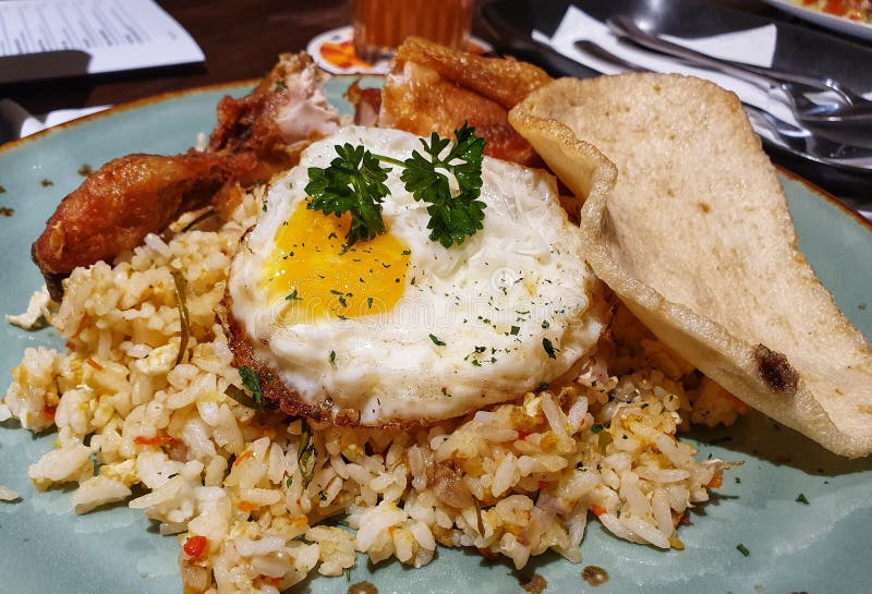 Special Fried Rice with Fried Chicken and Soft-boiled Egg Stock Photo ...