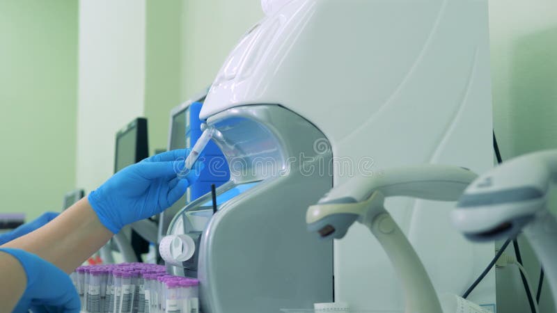A Nurse Scans Empty Tubes with a Barcode Scanner, Close Up. Stock Video ...