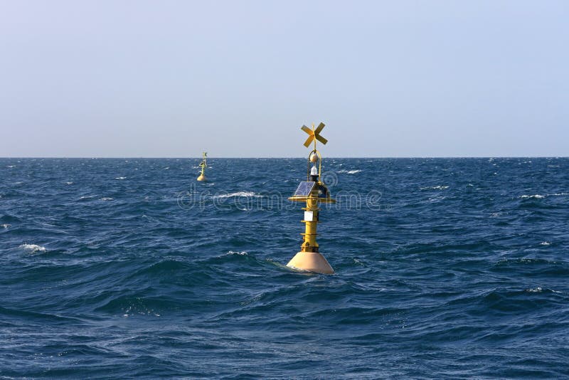 Red Navigational Buoy with Light on Top and Small Solar Panels for ...