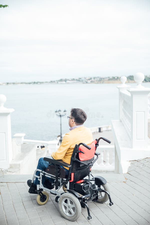 A Special Person with Disabilities by the Sea on a Walk Stock Photo ...
