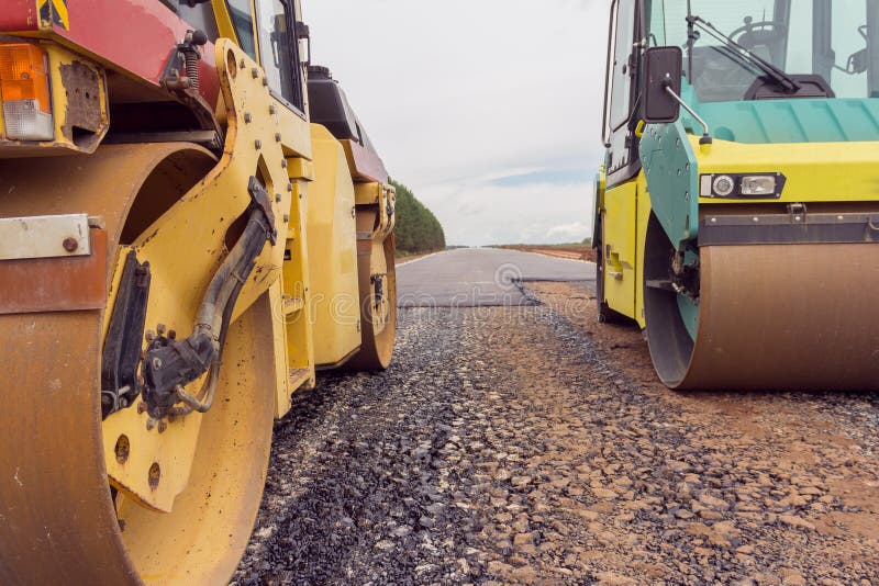 Compactor at Road Compaction Works. a Roller Compacting Asphalt on a ...