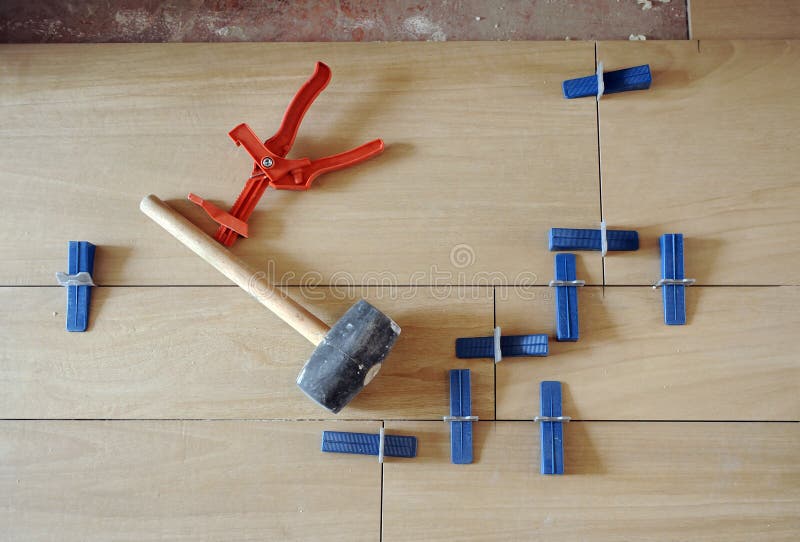 Special Tools and Rubber Hammer To Place a Porcelain Stoneware Floor ...