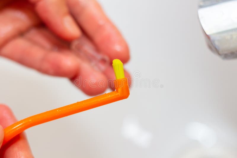 Special Toothbrush Under the Running Water in Bathroom Stock Image ...