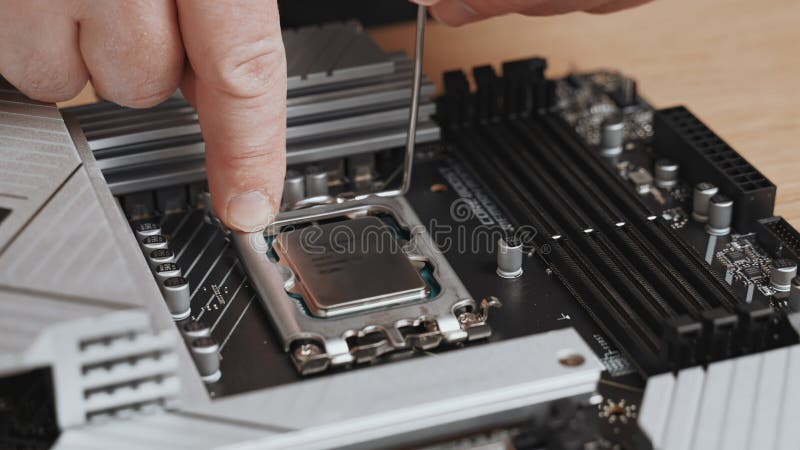 A Specialist Installs a Processor on a Motherboard and Fixes the Socket ...
