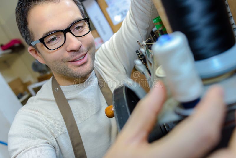Spectacled Man Threading Up Sewing Machine Stock Image - Image of ...