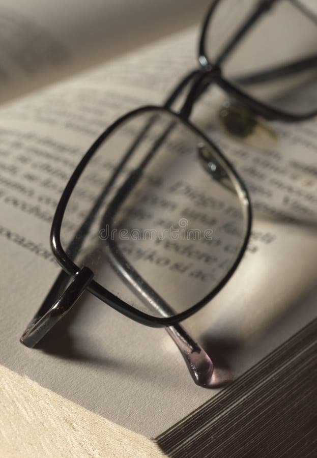 Spectacles on book page stock photo. Image of paper, optical - 86045482