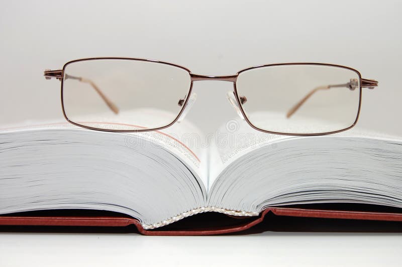 Spectacles Laying on the Open Book Stock Photo - Image of highschool ...