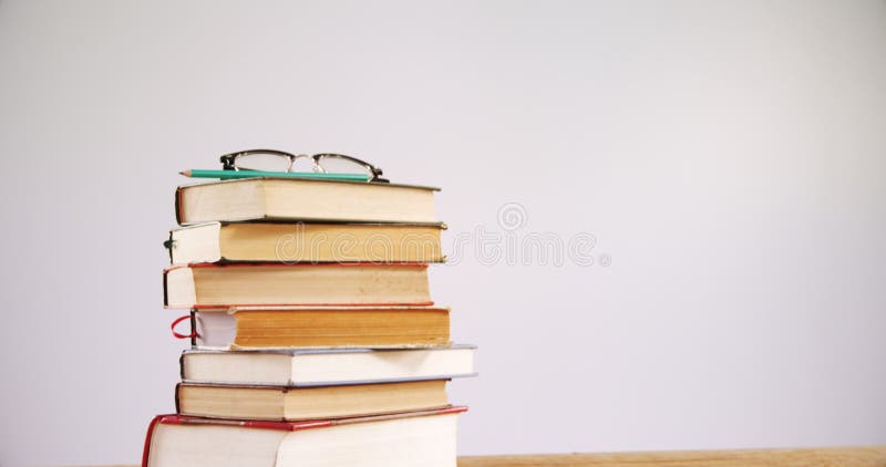 Spectacles and Pencil on Book Stack 4k Stock Video - Video of white ...