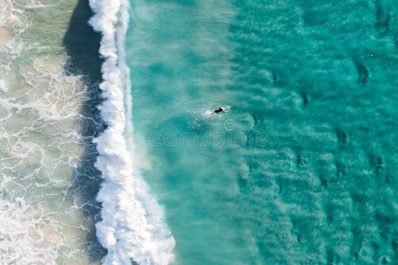 Spectacular Aerial View of a Surfer Taking on Waves in a Blue Ocean ...
