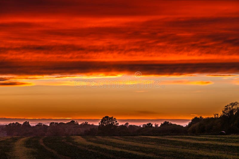 Spectacular, Bright Red Evening Sky Over a Field Stock Image - Image of ...