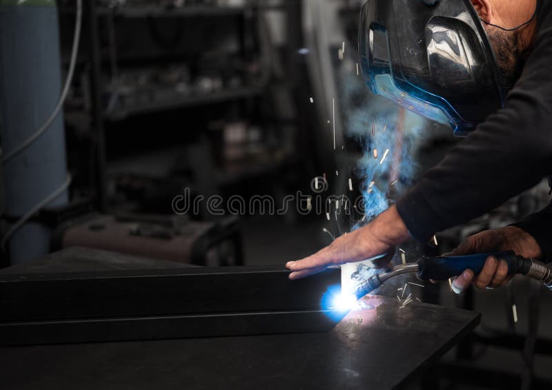 Spectacular Conceptual Image of a Blacksmith Busy Using the Welding ...