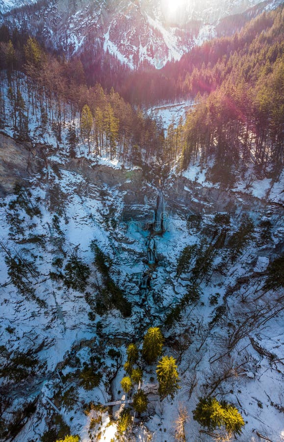 Spectacular Drop Down View of Waterfall Falling Over Rocky Forest Ledge ...