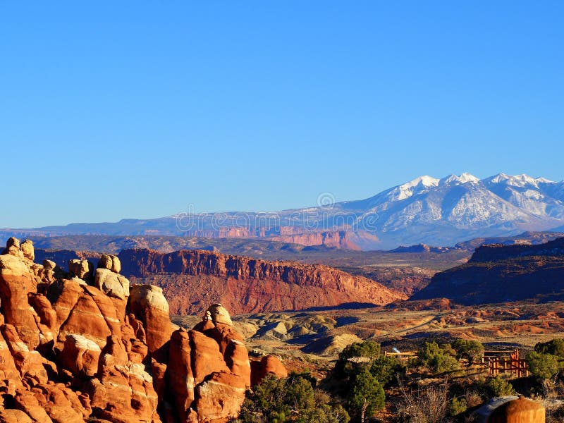 Red Sandstone Formations Layered Ridges with Mountains on the Horizon ...