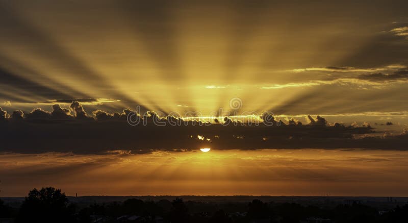 Golden Sunset Rays Breaking through Dramatic Cloudscape Stock ...