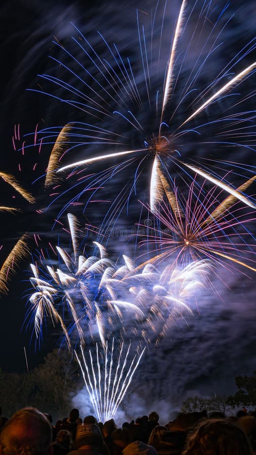 Spectacular Vertical View of a Crowd Watching Beautiful Fireworks ...
