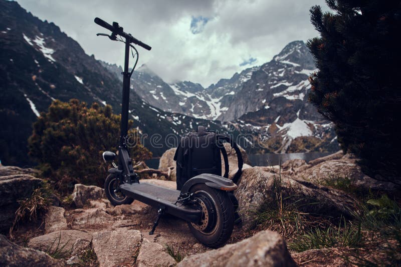 Scooter in the Beautiful Mountains with Pine and Low Clouds Stock Photo ...