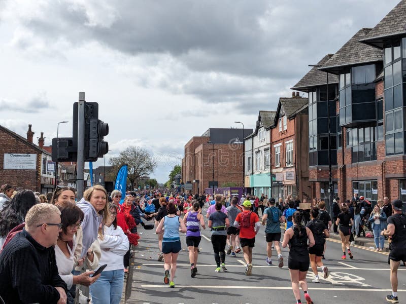 Spectators Watch Runners on the A56 on the Manchester Marathon 2024 ...