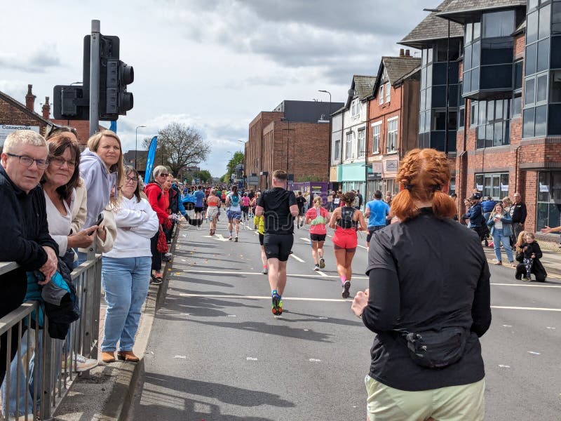 Spectators Watch Runners on the A56 on the Manchester Marathon 2024 ...