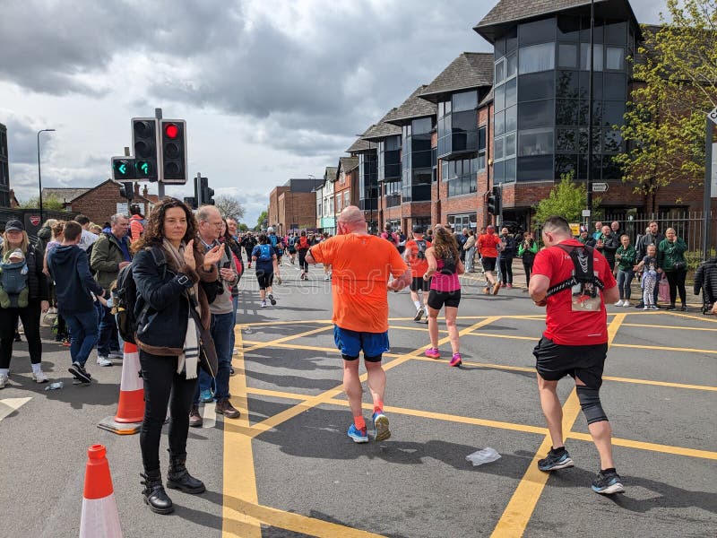 Spectators Watch Runners on the A56 on the Manchester Marathon 2024 ...
