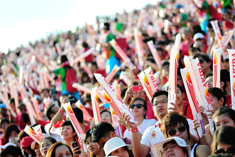 Spectators Waving Clappers during NDP 2012 Editorial Stock Image ...