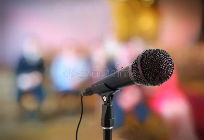 Speech or Conference Concept. Microphone on Stand in Front of Audience ...